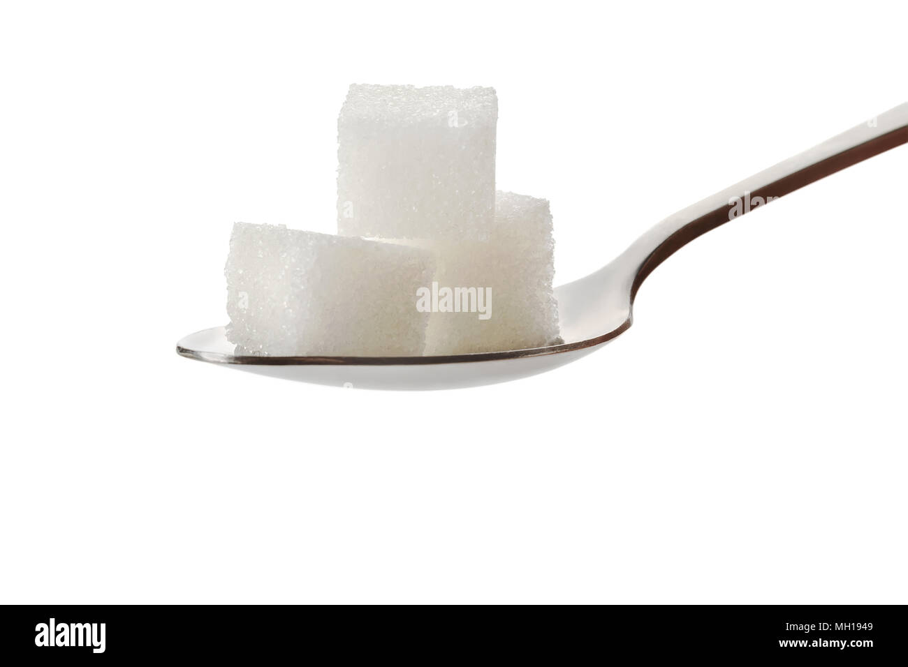 Three cubes of sugar on a spoon on a white background Stock Photo - Alamy