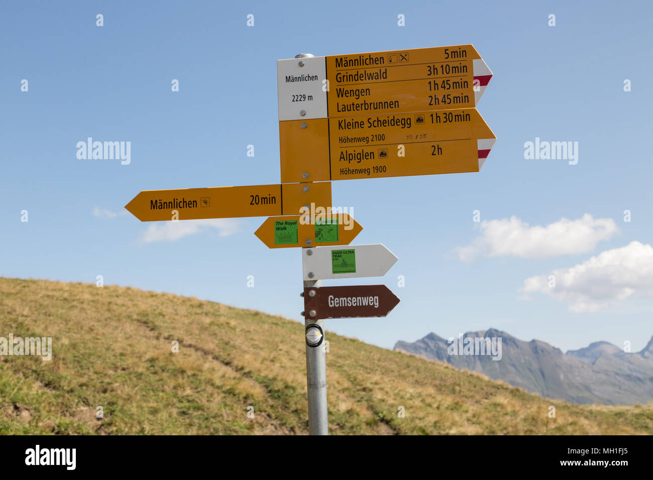 Directional sign marking hiking trails in the Swiss Alps Stock Photo ...