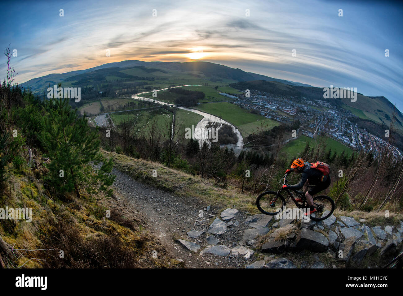 A man rides a mountain bike on a trail near the town of Innerleithen ...