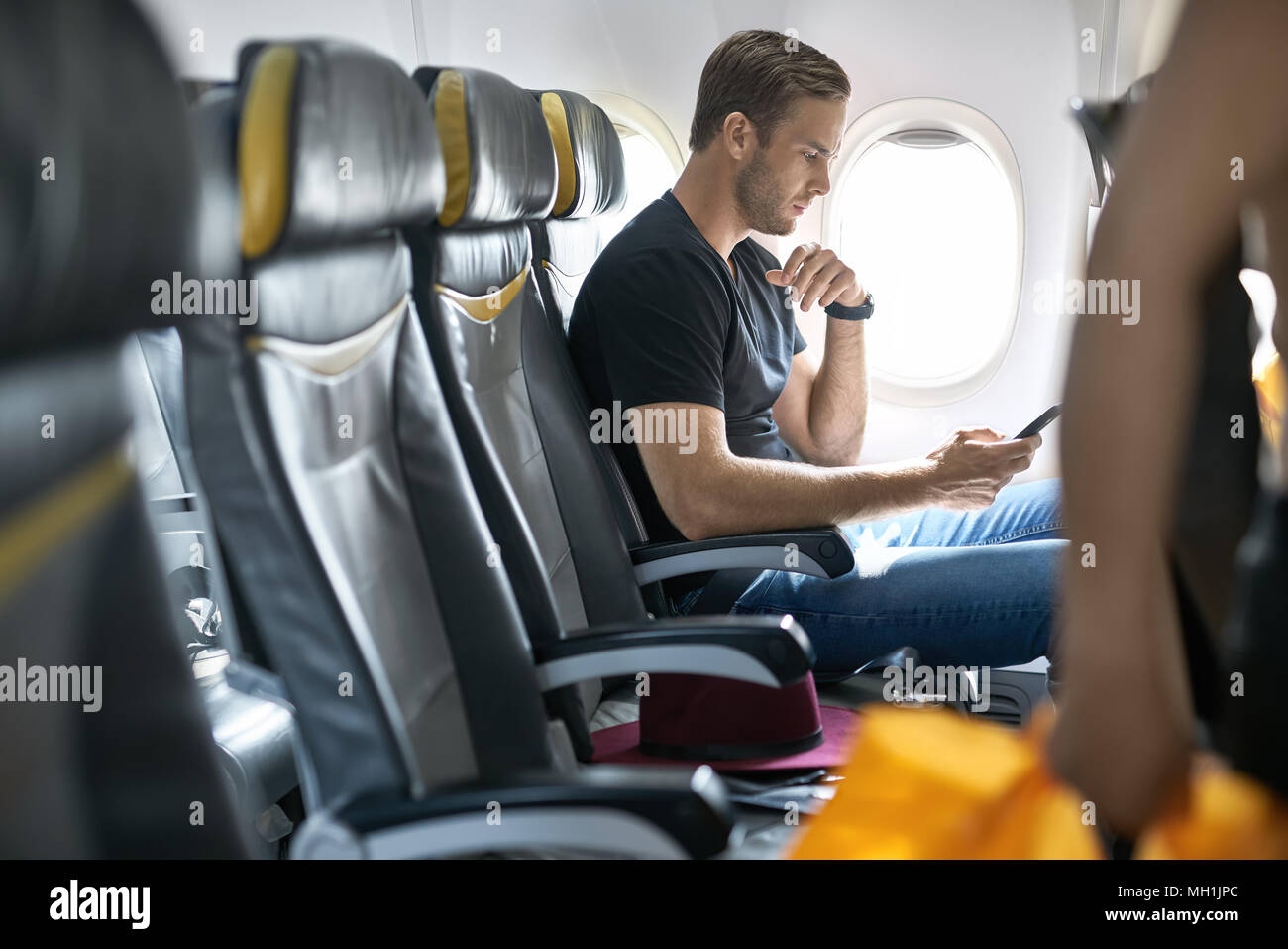 Airplane traveler hi-res stock photography and images - Alamy