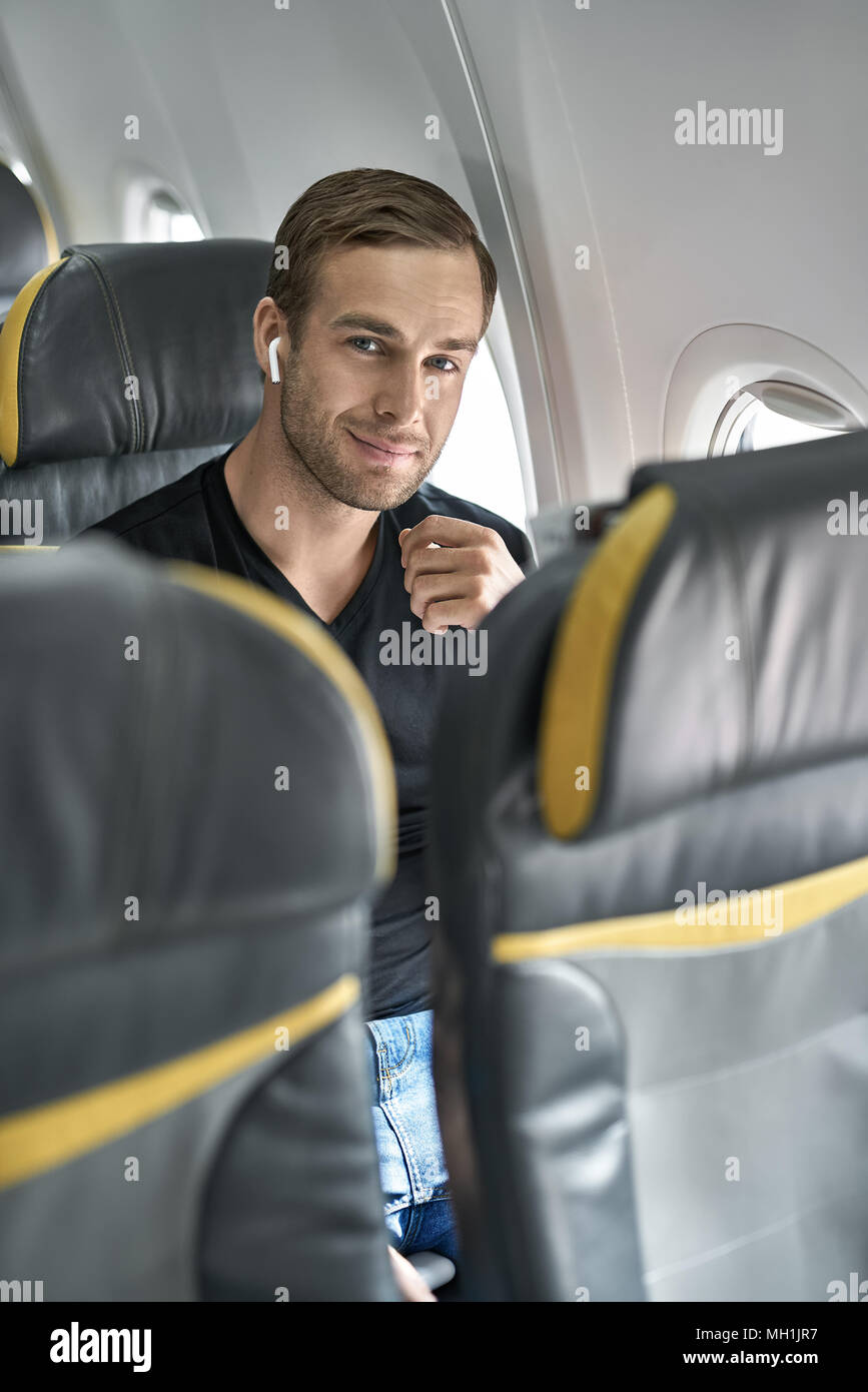 Handsome guy in airplane Stock Photo - Alamy
