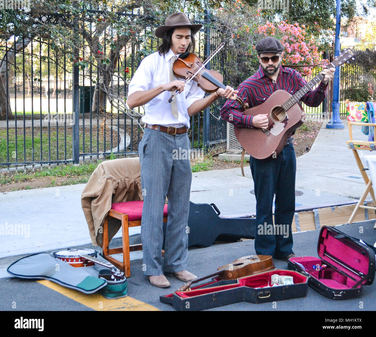 Entertainers play the fiddle and guitar at the Farmer's Market in ...