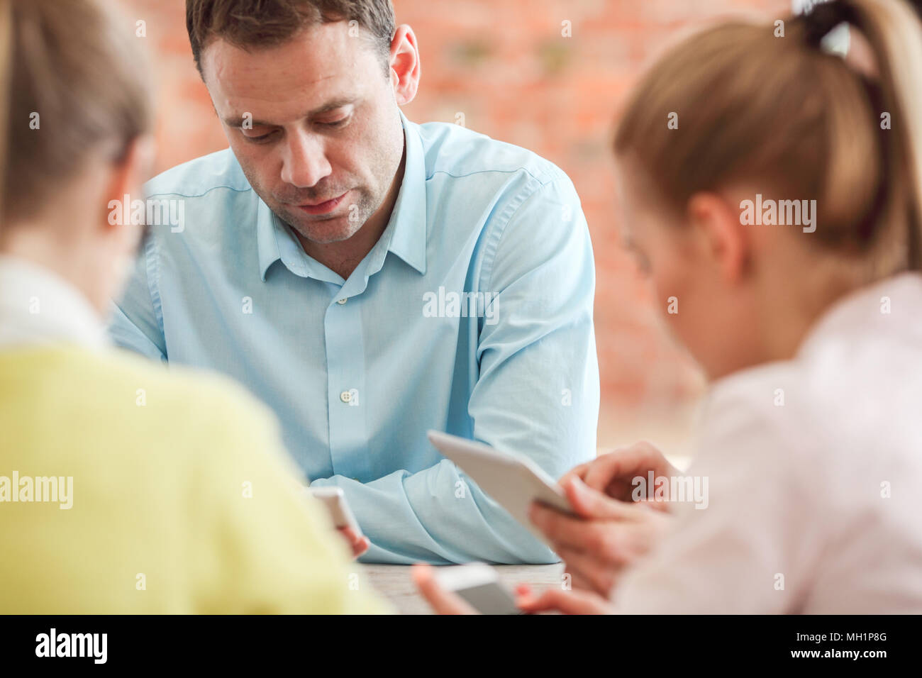 Group of multi generation people use technology together of smartphones ...