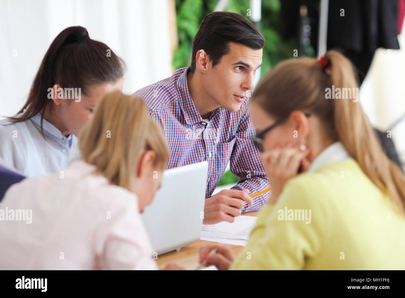 Business team work together at workplace, focus on young man Stock ...