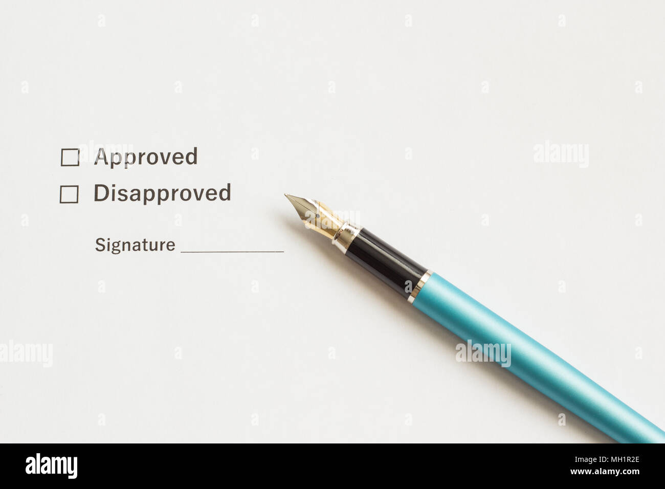 Document with a place for a signature and a pen closeup Stock Photo - Alamy