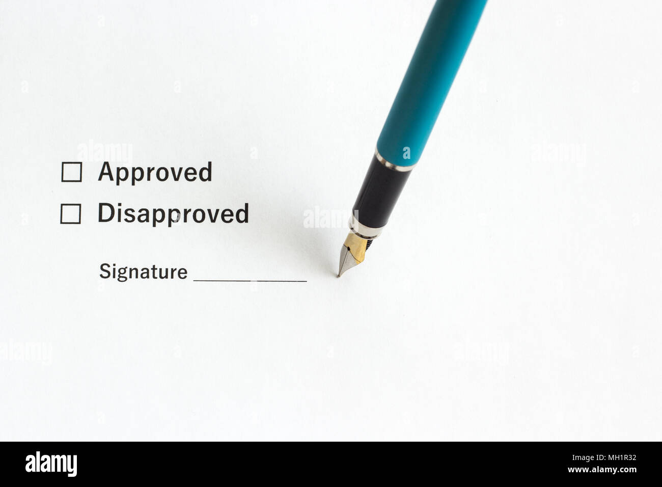 Document with a place for a signature and a pen closeup Stock Photo - Alamy