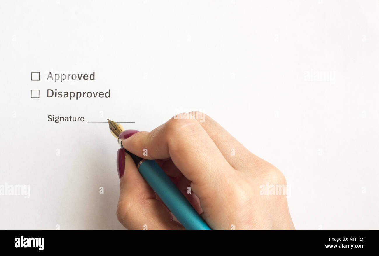 Pen in woman's hand isolated on white background Stock Photo - Alamy