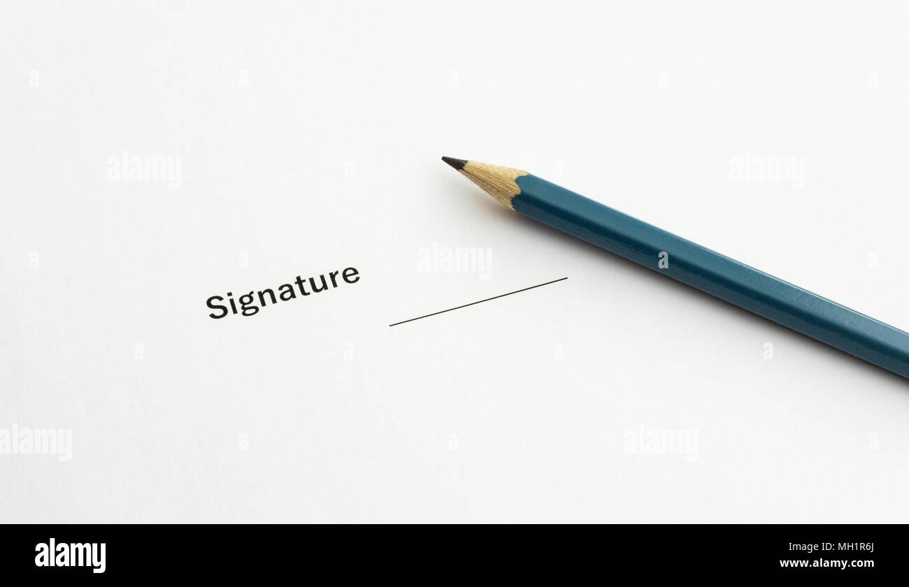Important document for signing with a pencil, closeup Stock Photo - Alamy