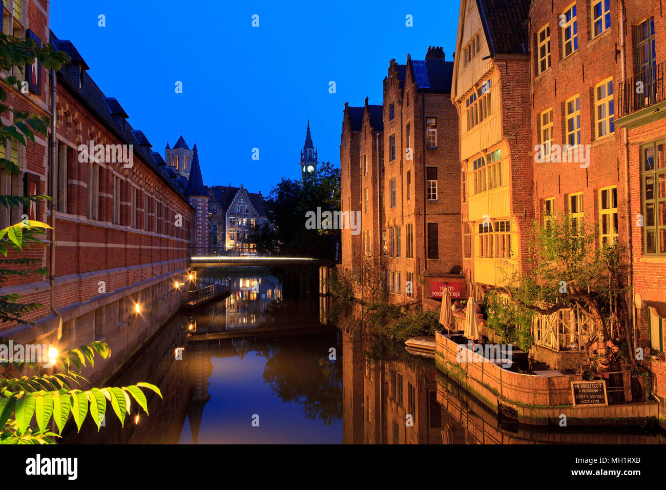 A picturesque view at the medieval waterfront along the Lieve Canal at ...