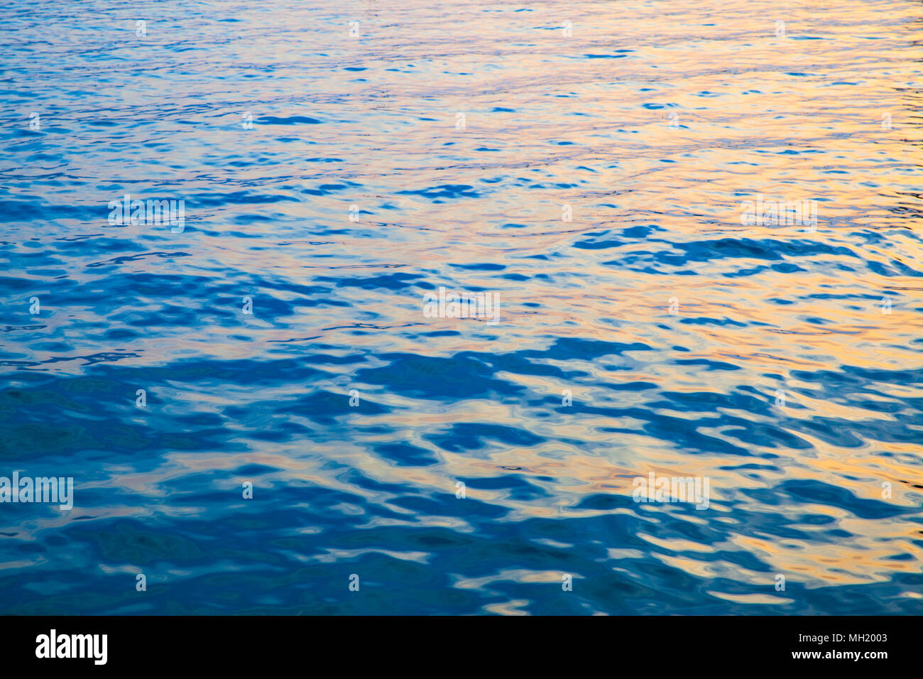 Texture of water surface at sundown - natural background. Space for ...