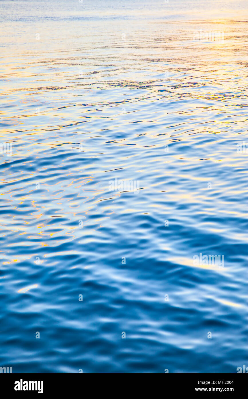 Texture of water surface at sundown - vertical photo background. Space ...