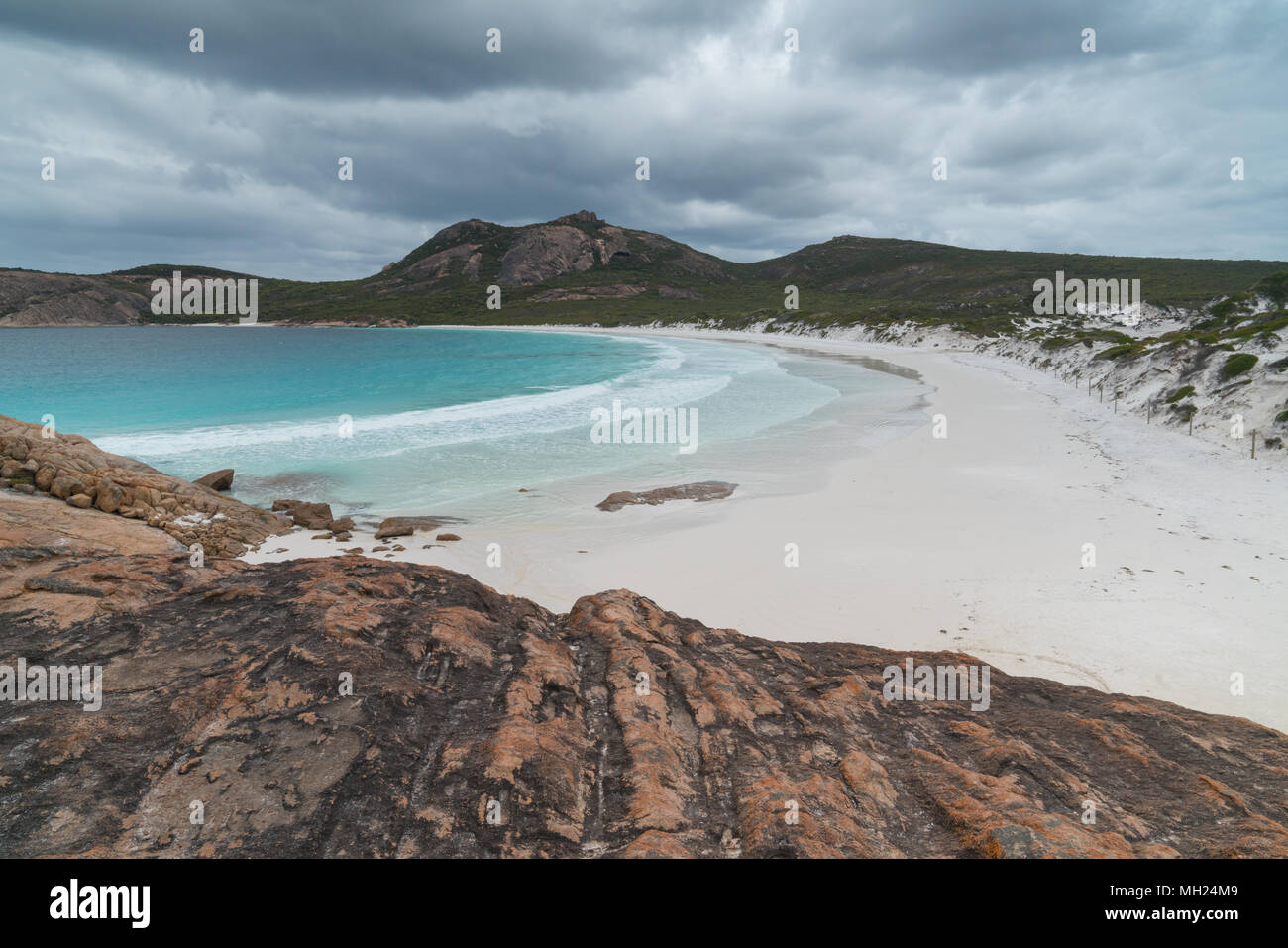 White beach of Thistle Cove on an overcast day, one of the most ...