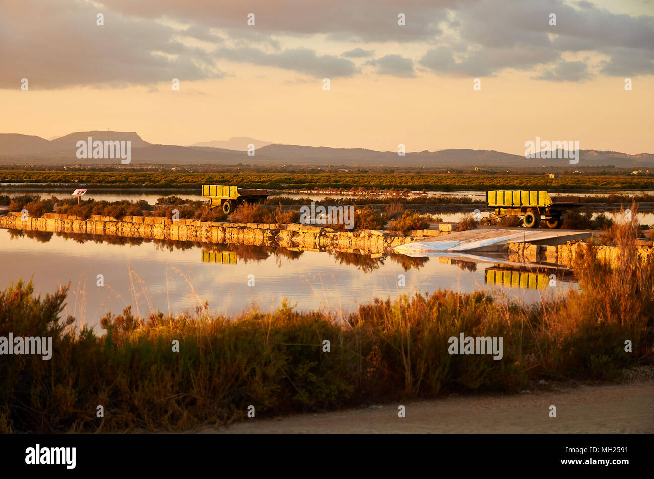 Salt wagons at sunset in Salinas de Es Trenc facilities at Es Trenc ...