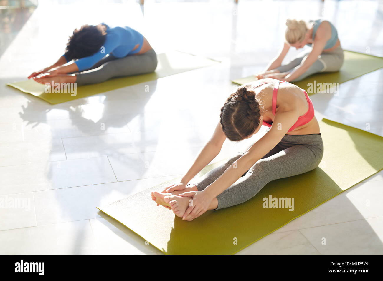 Exercising on the floor Stock Photo - Alamy