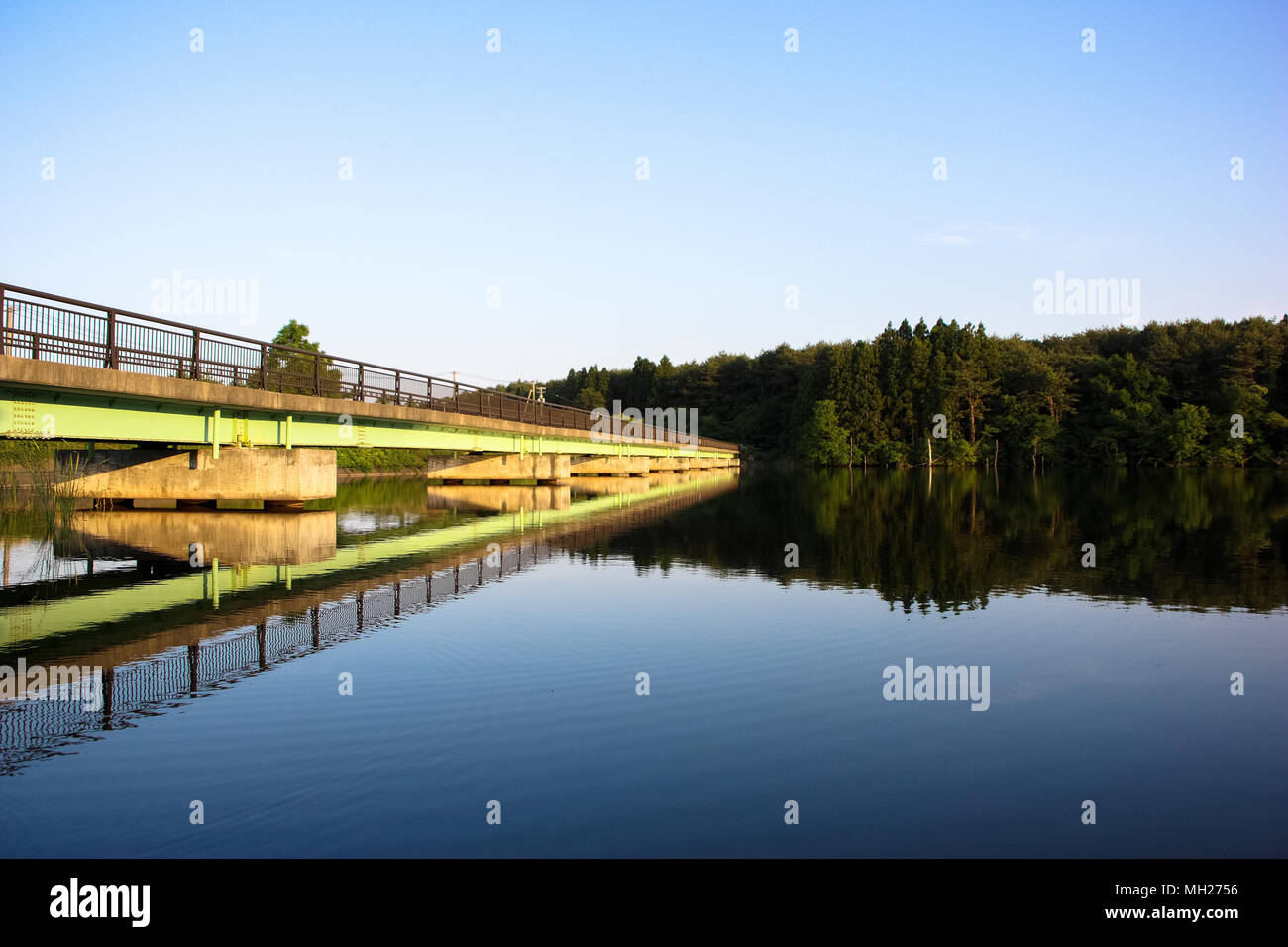 Green bridge over a lake in Japan Stock Photo - Alamy