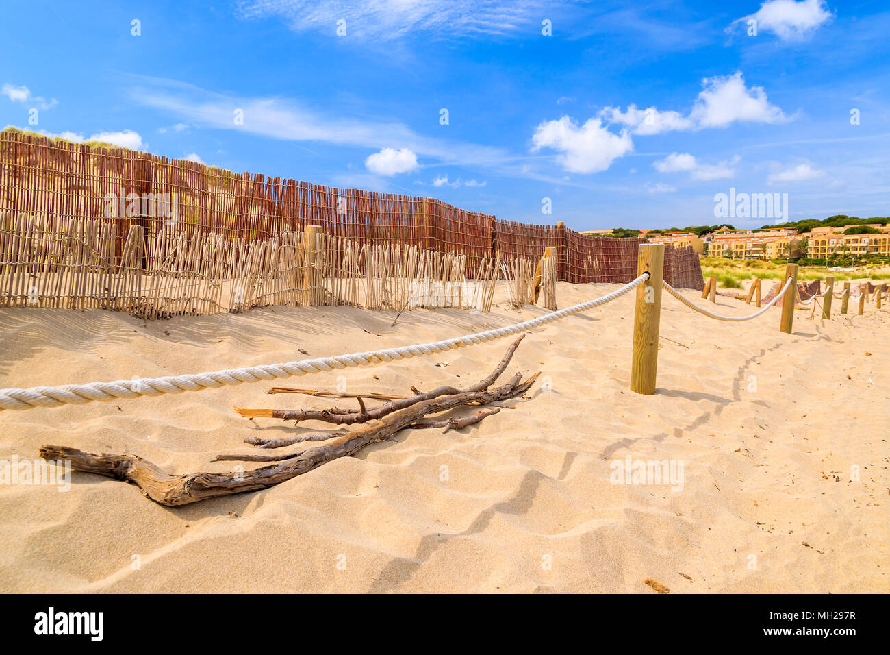 Sand dune and wind fence on Cala Mesquida beach, Majorca island, Spain ...