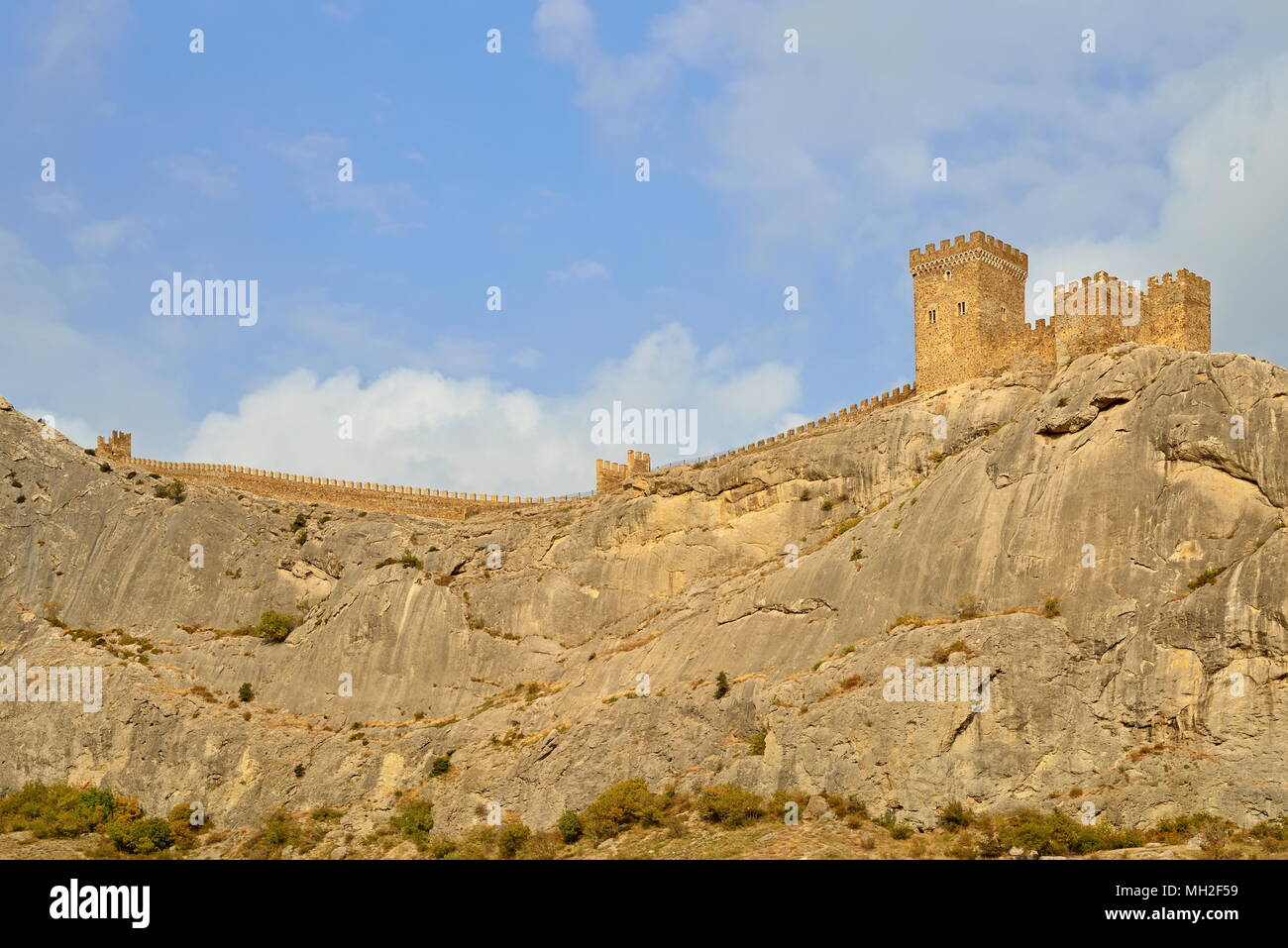 View of the Genoese fortress in Sudak town, sea. Crimea Stock Photo - Alamy