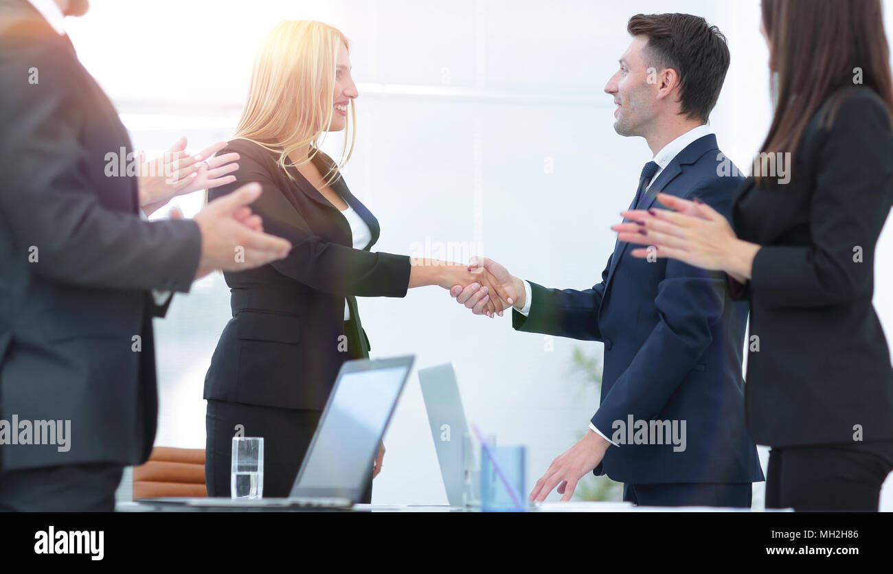 Business a man standing over a desk hi-res stock photography and images ...