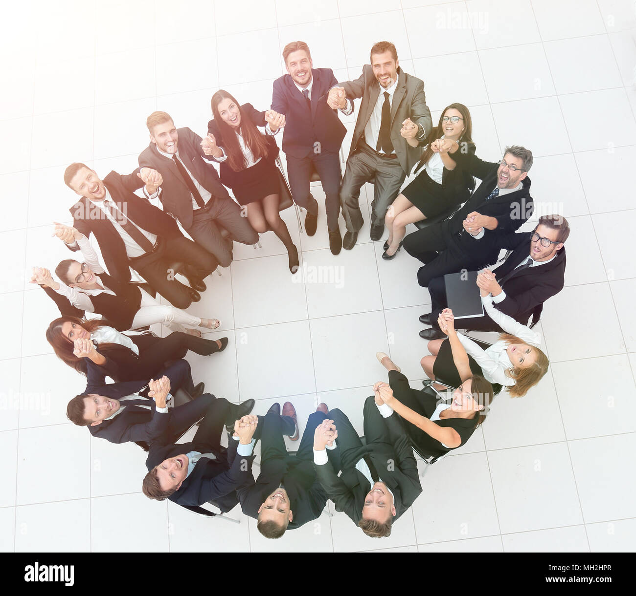 successful business team sitting in a circle and took each other's ...