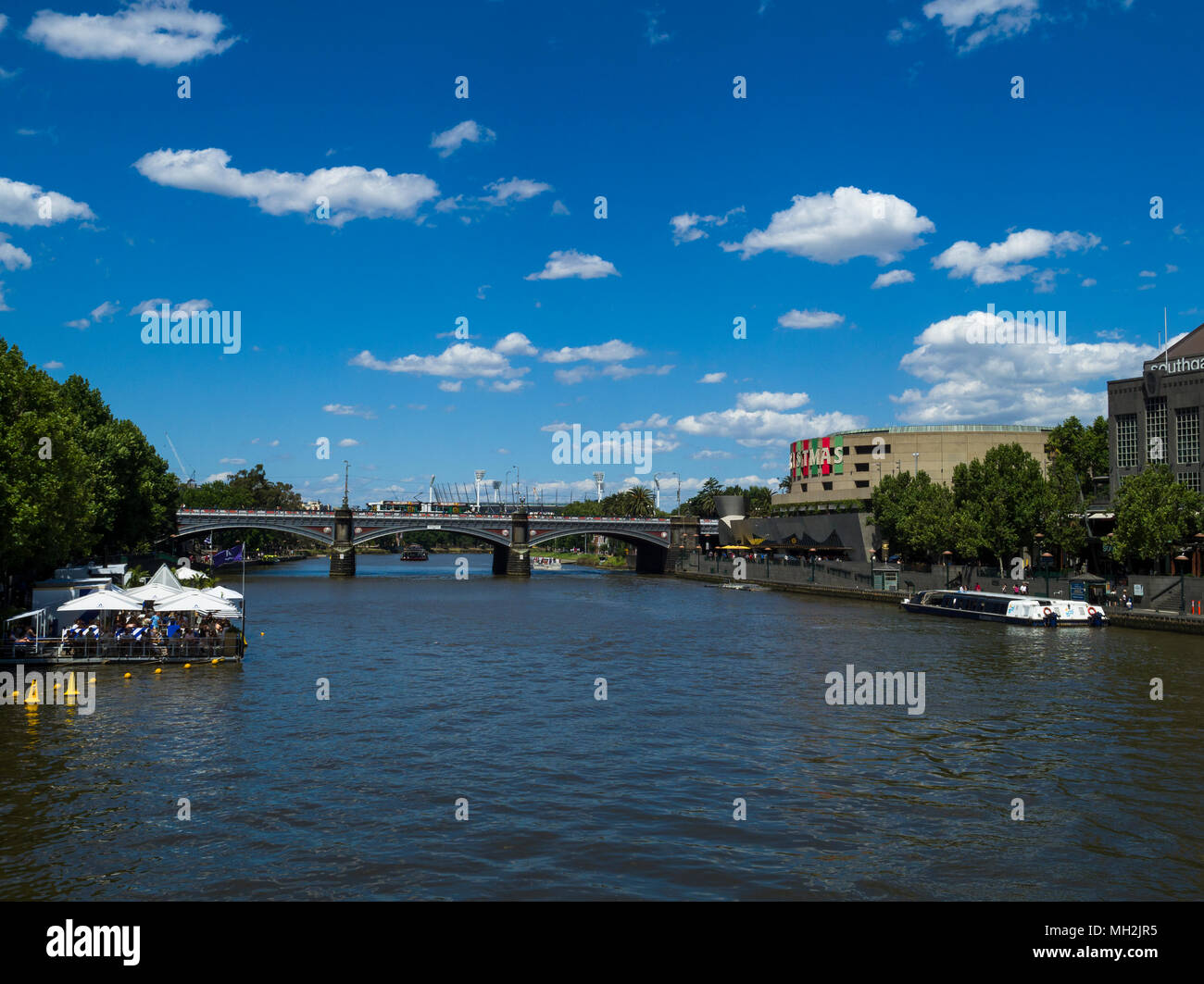 Yarra river with tram crossing Princes Bridge and Melbourne Cricket ...