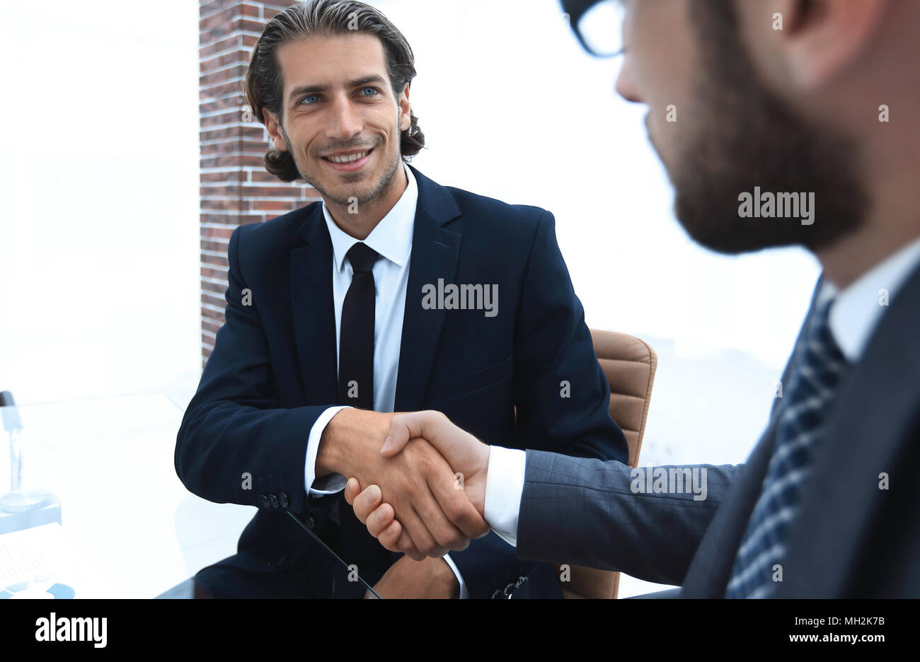 bottom view. confident handshake of business partners Stock Photo - Alamy