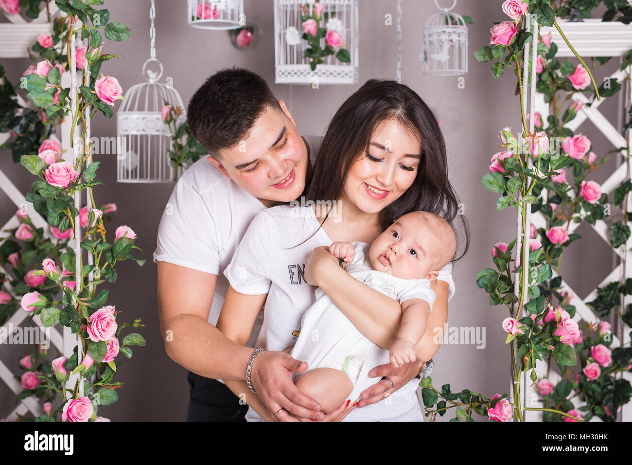 Indoor portrait of asian mixed race family with infant baby Stock Photo ...