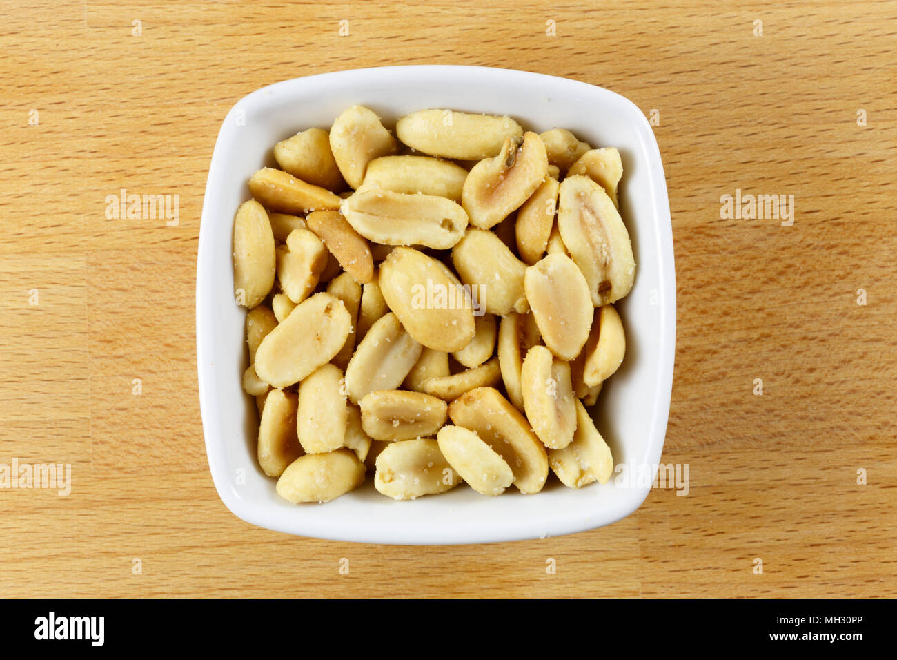 Roasted & salted peanuts. The peanut or groundnut, Arachis hypogaea, is ...