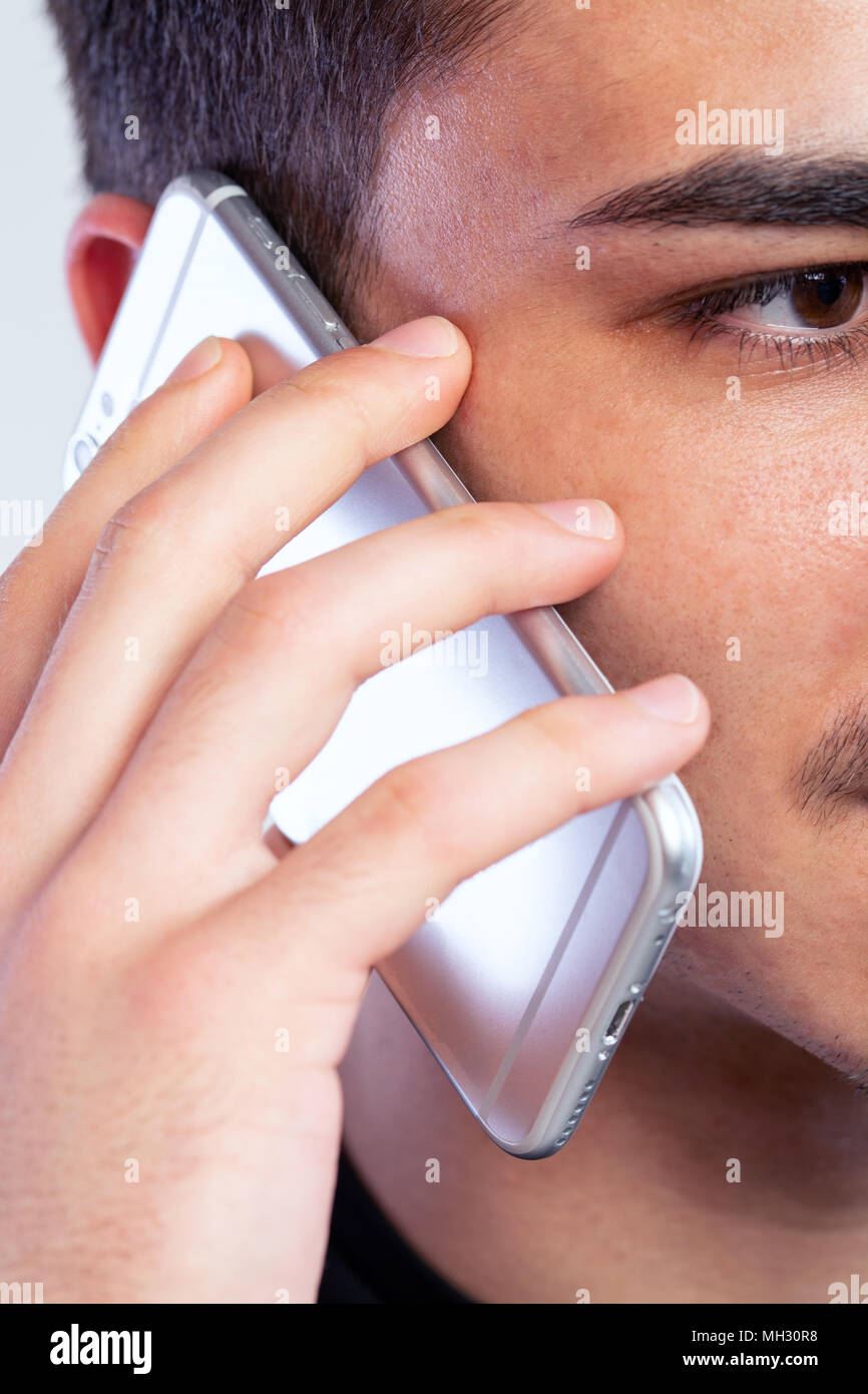 a young man with black using the phone, hand grabing a phone Stock ...