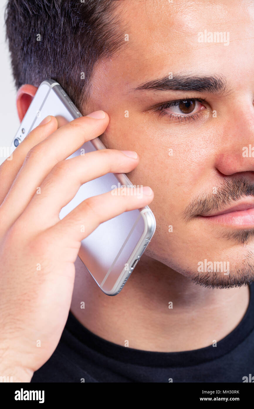 a young man with black using the phone, hand grabing a phone Stock ...