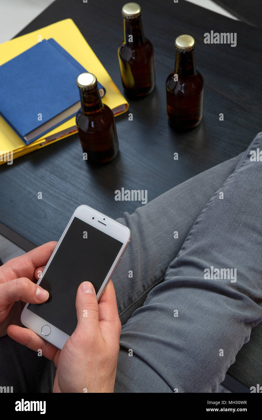 a young man with black using the phone, hand grabing a phone Stock ...