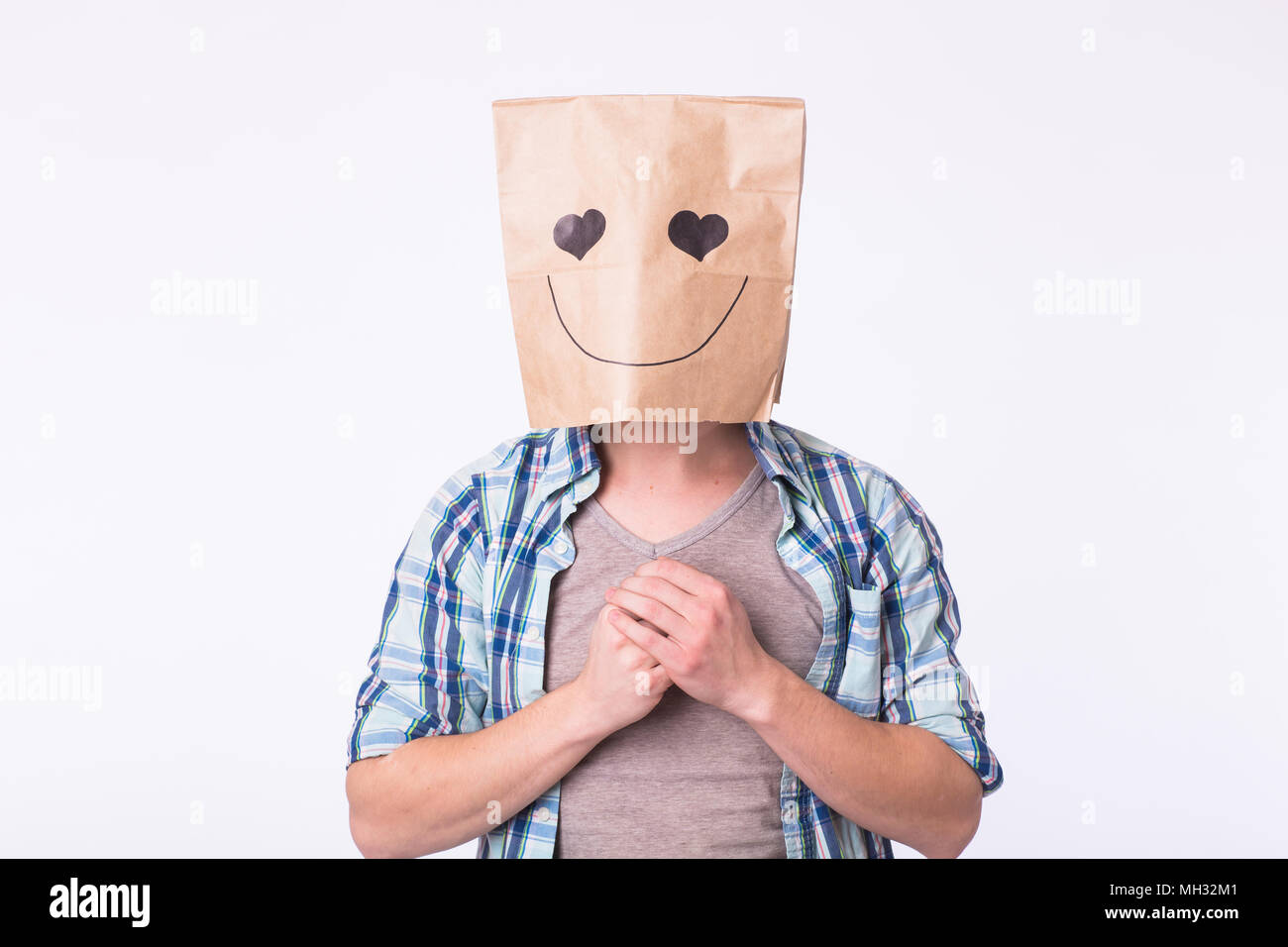 Love, emotion and relationship concept - Man with cardboard box on his ...