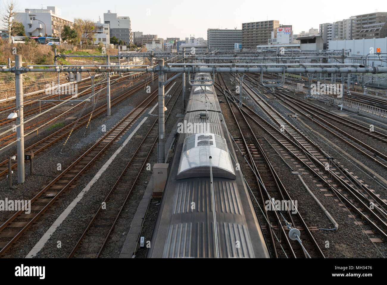 Railway tracks and passenger train in Tokyo, Japan Stock Photo - Alamy