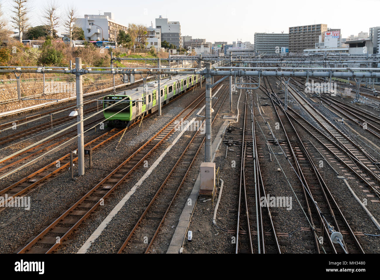 Railway tracks and passenger train in Tokyo, Japan Stock Photo - Alamy