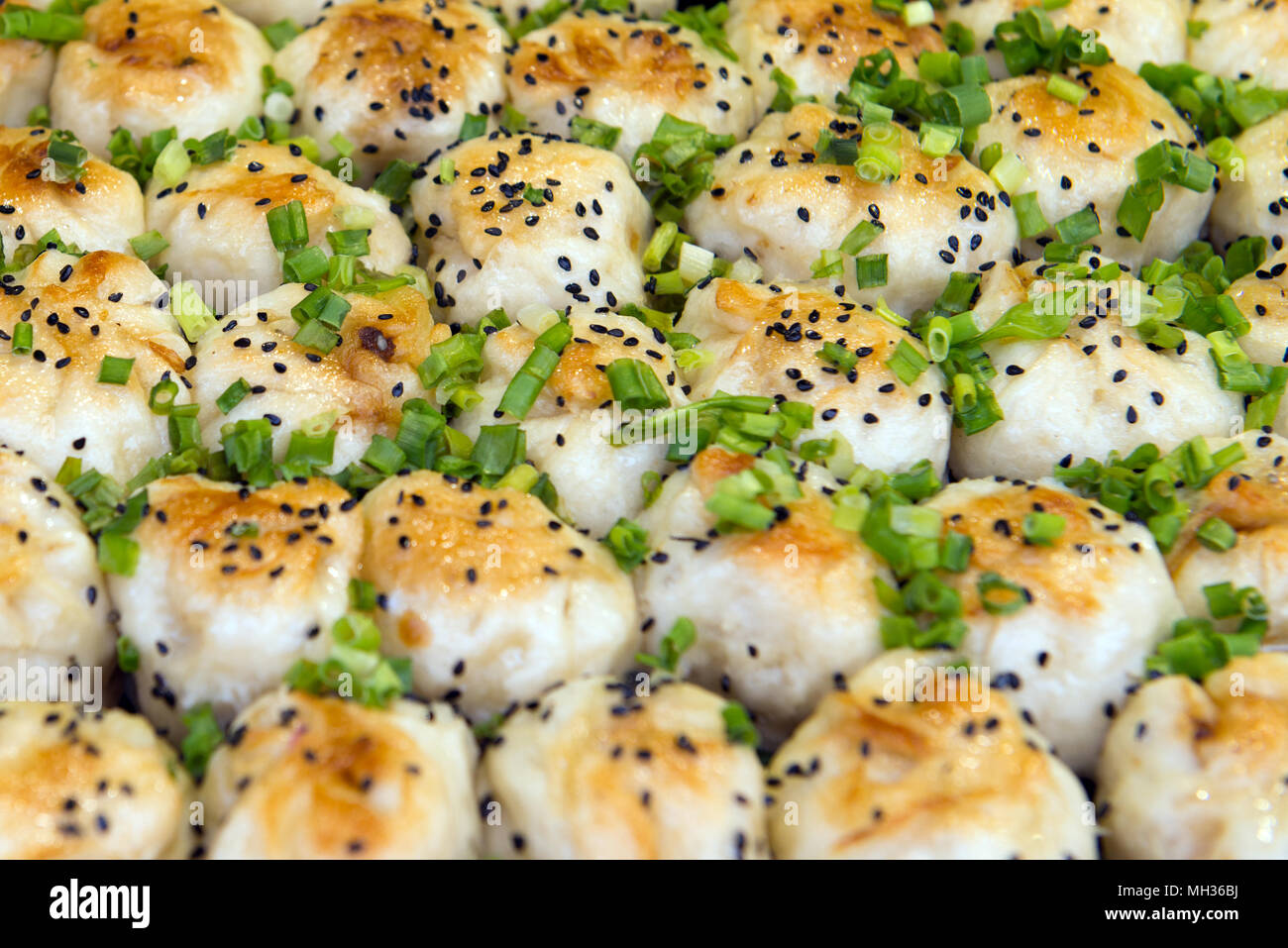 Pan fried baozi at Wangfujing street, Beijing China Stock Photo - Alamy