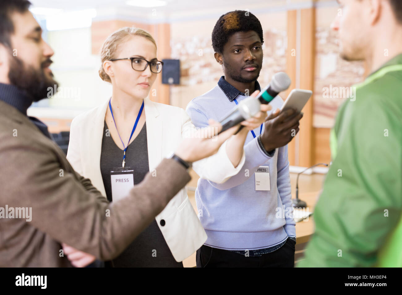 Reporters Taking Interview Stock Photo - Alamy
