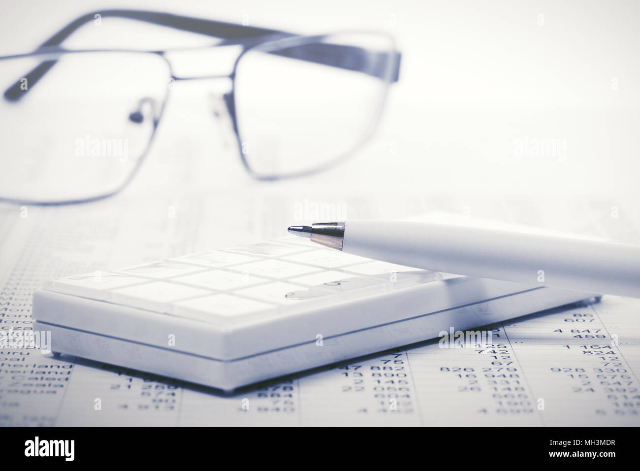Financial accounting. Pen and calculator on balance sheets Stock Photo ...