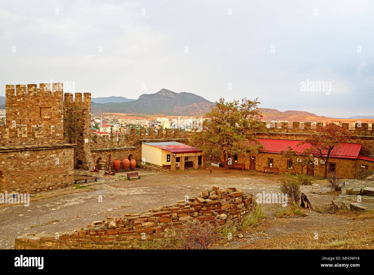 A view of the city of Sudak and the Genoese fortress at sunset. Crimea ...