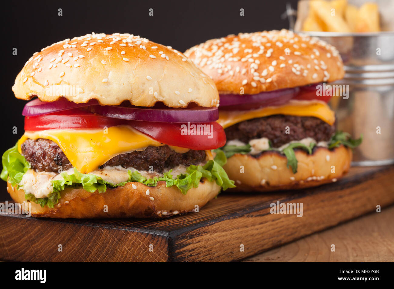Close-up of delicious fresh home made burger with lettuce, cheese ...
