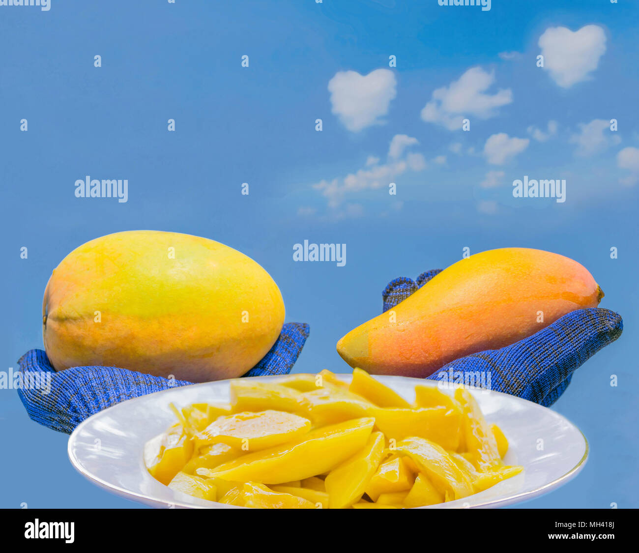 Abstract the cut of ripe mango fruit on the plate the hand with the ...