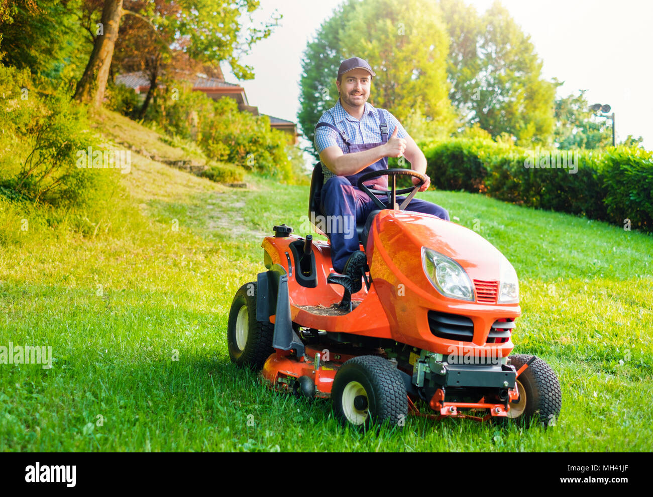 Driving a lawn mover hi-res stock photography and images - Alamy