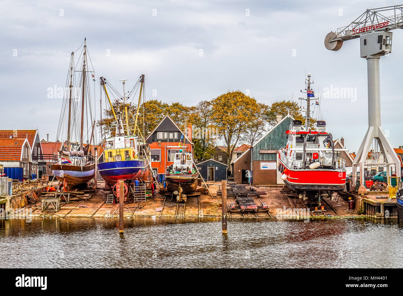 A dry dock for ship repairs on the Dutch fishing boats in the harbor of ...