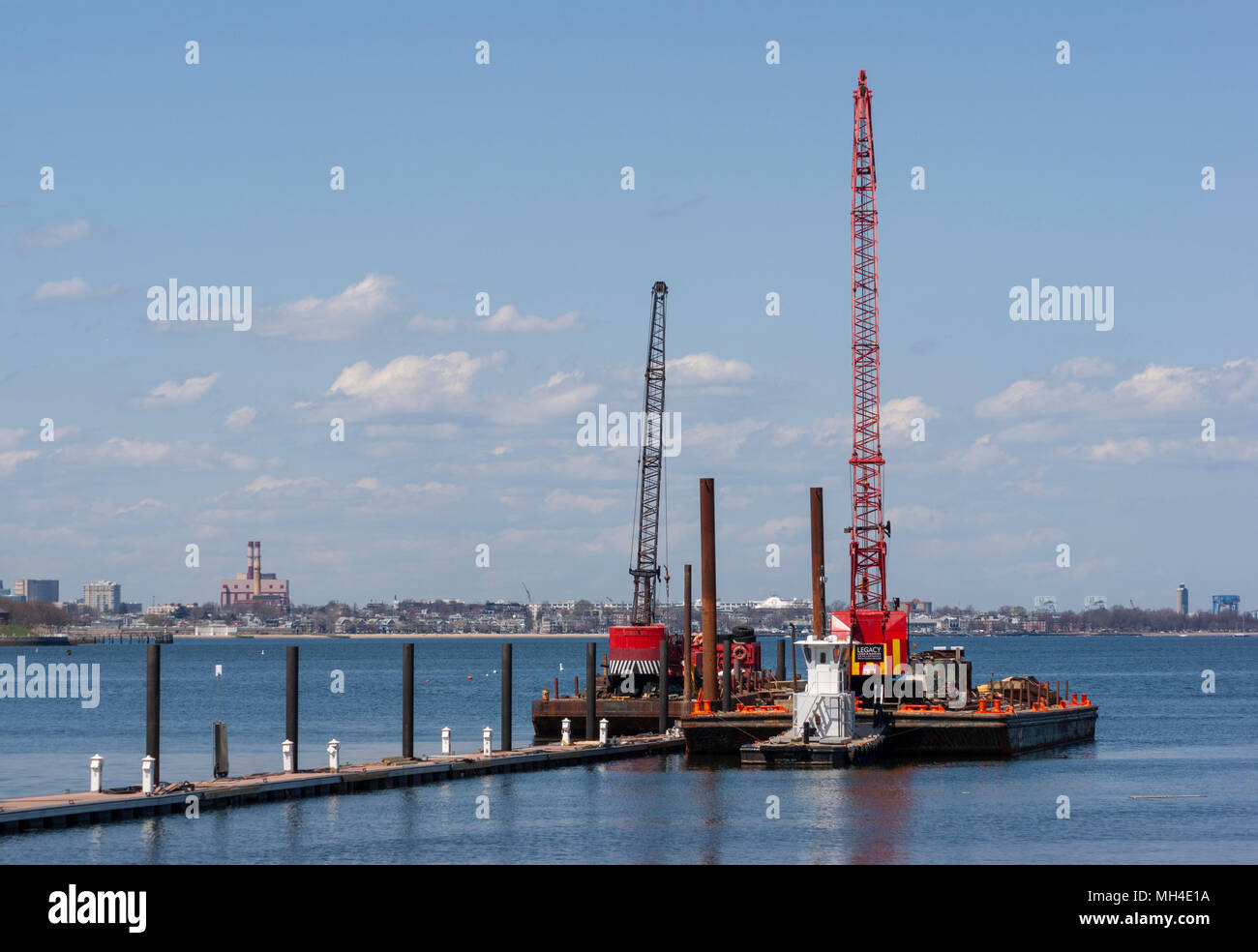 Marine construction barges with cranes for pile driving. Marina Bay ...