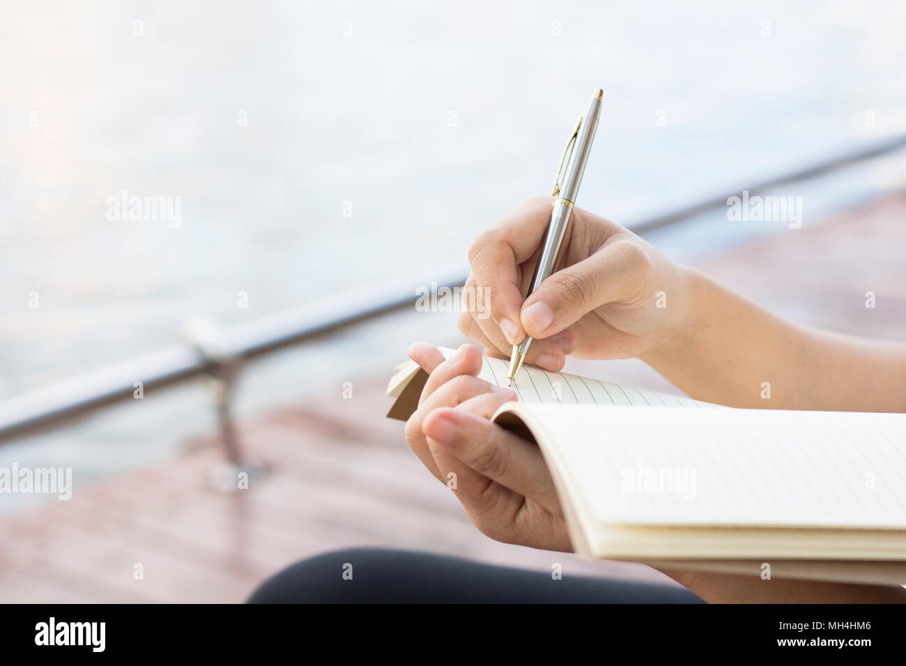 Writing dairy on notebook in coffee shop, concept as memory of life and ...