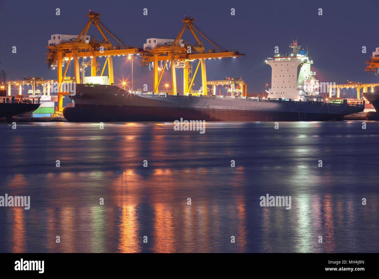 large container boat approaching on commercial port for loading ...