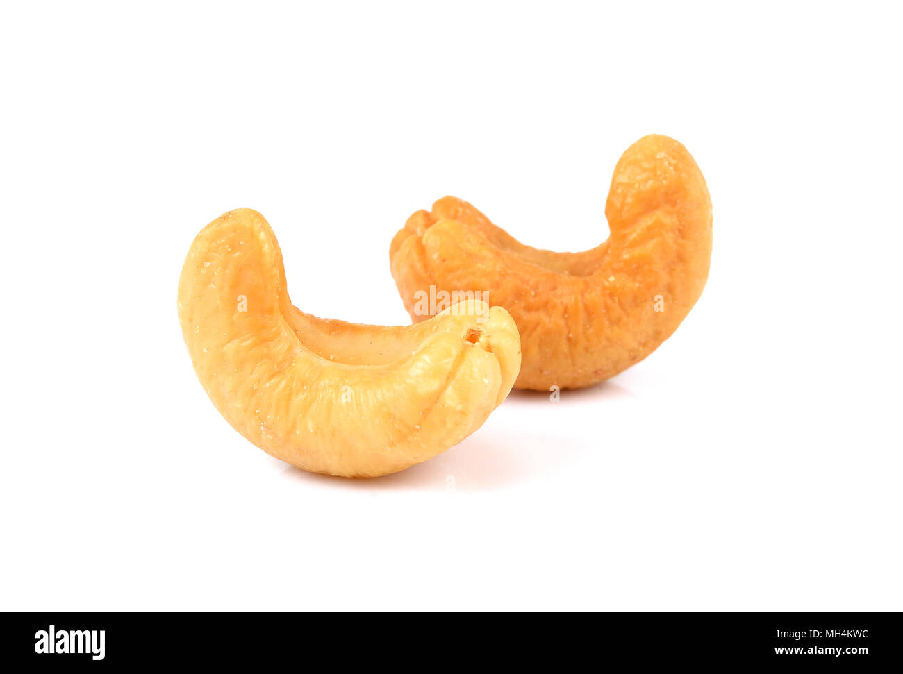 Roasted cashew nuts isolated on white background Stock Photo - Alamy