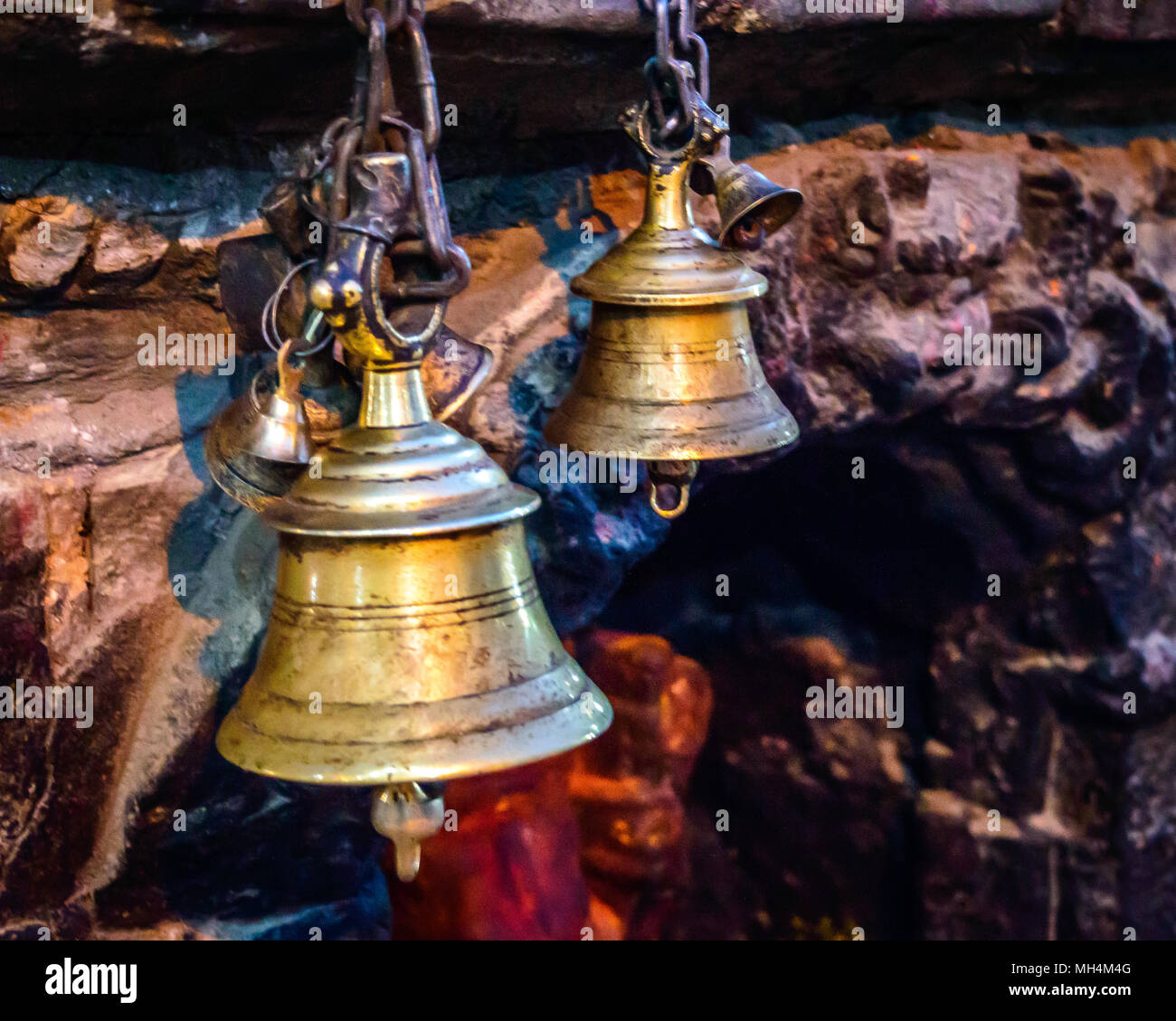 In Hinduism, bells are generally hung at the temple dome in front of ...