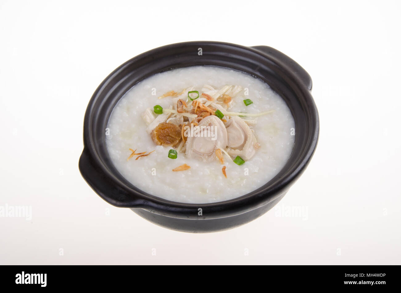 Porridge, abalone & chicken Porridge (congee) served in claypot Stock ...