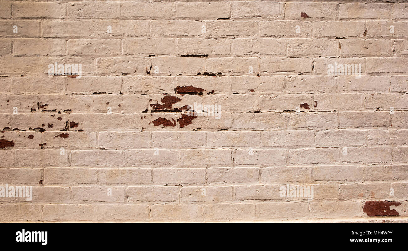 Background texture of brick wall with old chipped paint with some ...