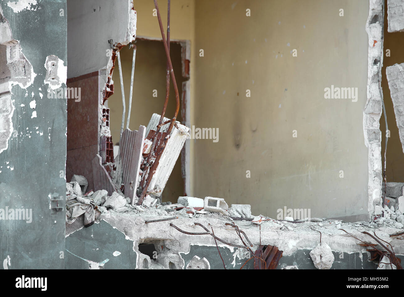 big hole on the wall of the destroyed house during the bombings Stock ...