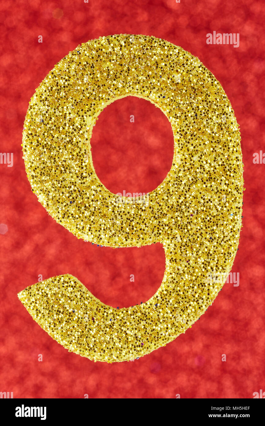 Number nine gold color over a red background. Anniversary. Vertical ...